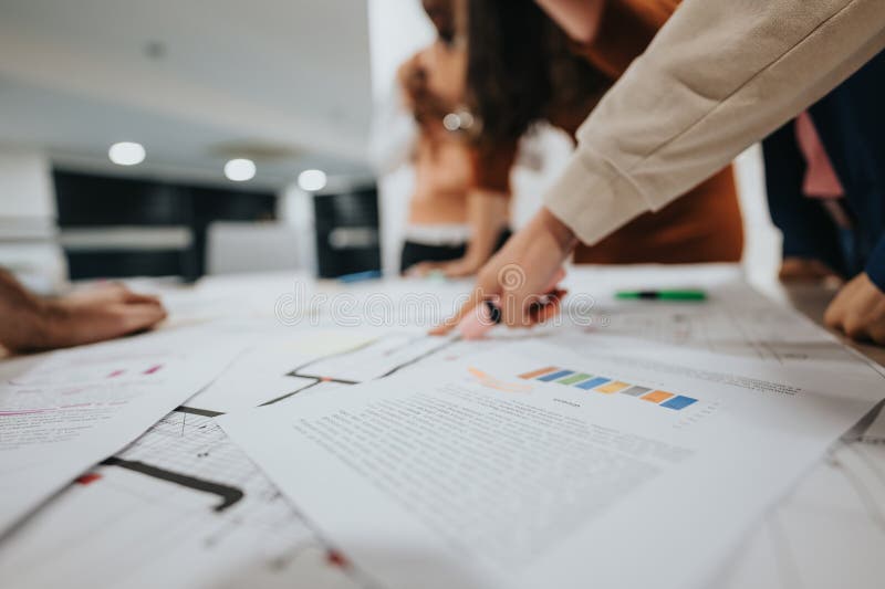 Colleagues Collaborating on Business Growth Strategies during a Late ...