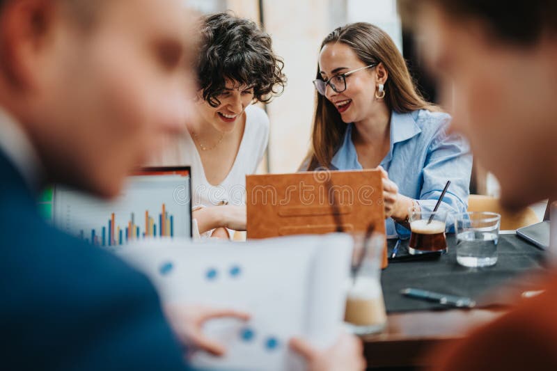 Colleagues Collaborating on Project during Business Meeting with Charts ...