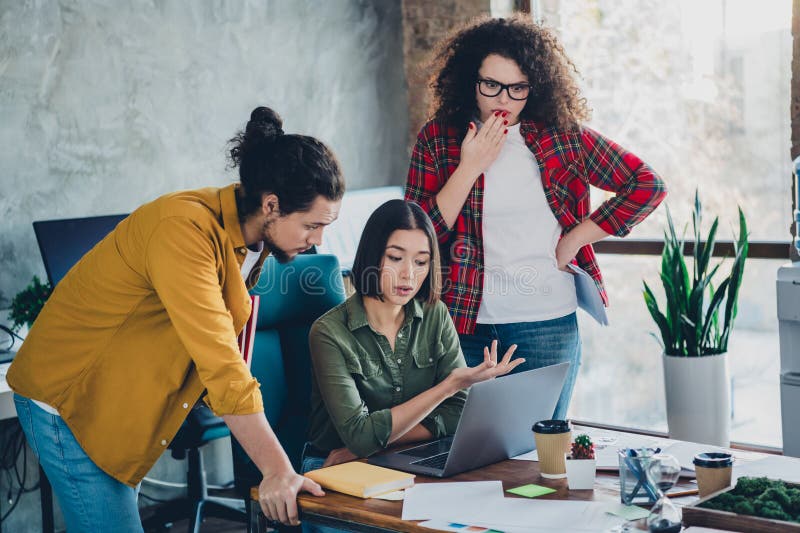 Colleagues Collaborating on a Project in a Modern Office Environment ...