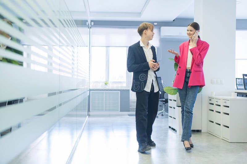 Colleagues Communicate during a Break at Work. Stock Image - Image of ...