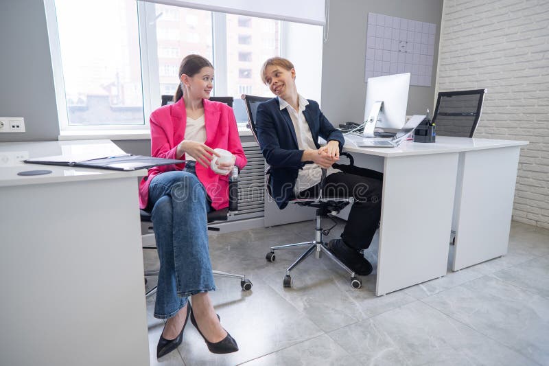 Colleagues Communicate while at Work in the Office. Stock Photo - Image ...