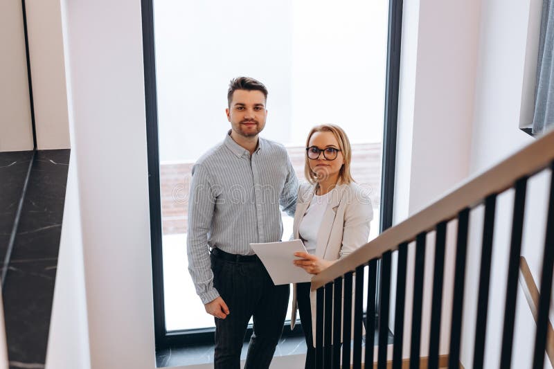 Colleagues Communicating in Modern Office Discussing Sales Work Plan ...