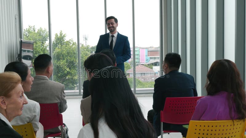 In a Modern Office, a Multiethnic Group Works and Discusses Together ...