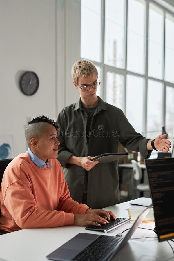 Colleagues Discussing Codes of Software Stock Image - Image of office ...