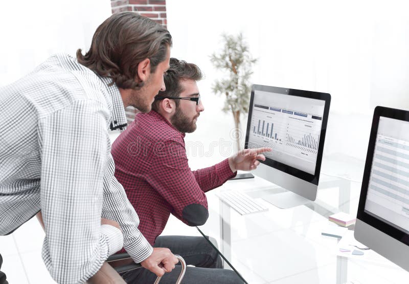Colleagues Discussing Financial Data in Office Stock Image - Image of ...