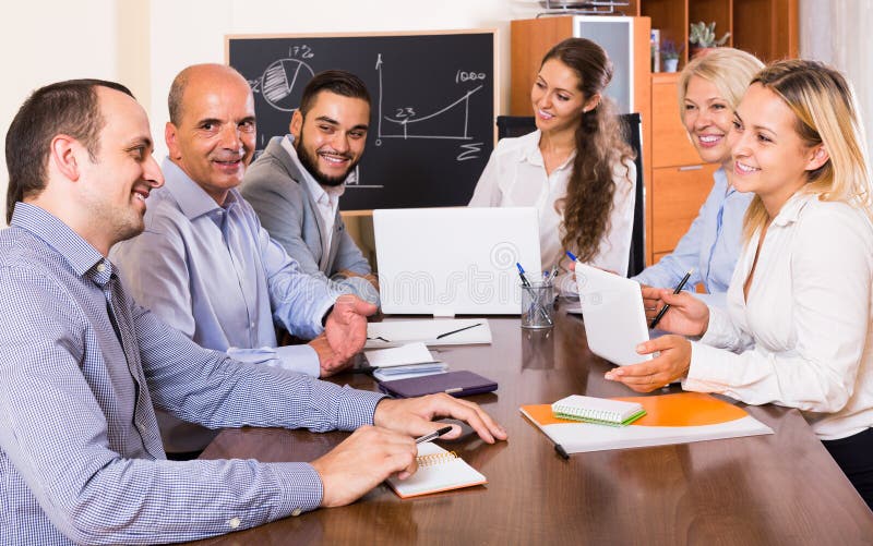 Colleagues Discussing Price Development at Office Stock Photo - Image ...