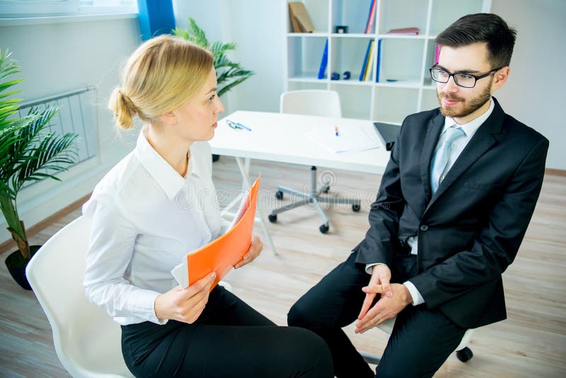 Colleagues discussing work stock image. Image of application - 89380169