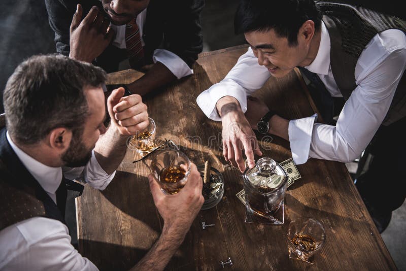 Colleagues Drinking Alcohol while Spending Time Together Stock Image ...
