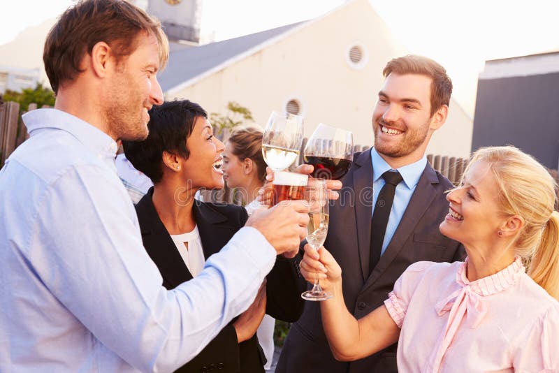 Colleagues Drinking after Work at a Rooftop Bar Stock Photo - Image of ...
