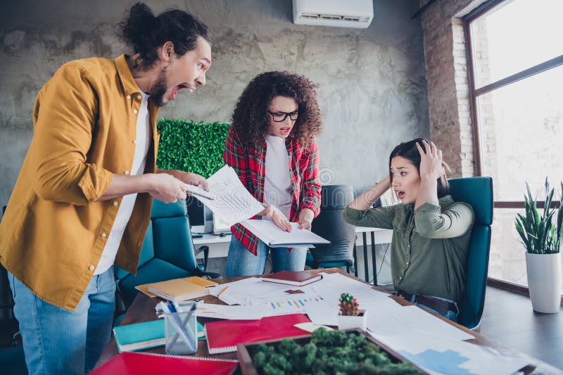 Colleagues Engaged in a Tense Discussion at a Workplace Setting Amidst ...