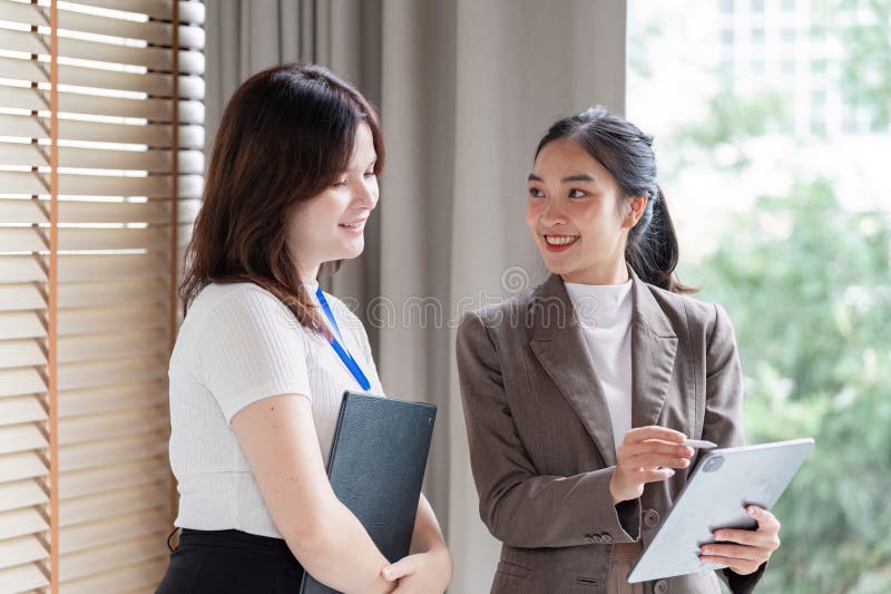 Colleagues Engaging in Strategic Planning Using Technology in Office ...