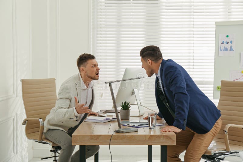 Colleagues Fighting at Table in Office. Workplace Conflict Stock Image ...