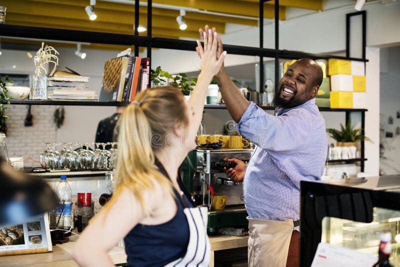 Colleagues Give a High Five To Each Other Stock Photo - Image of ...