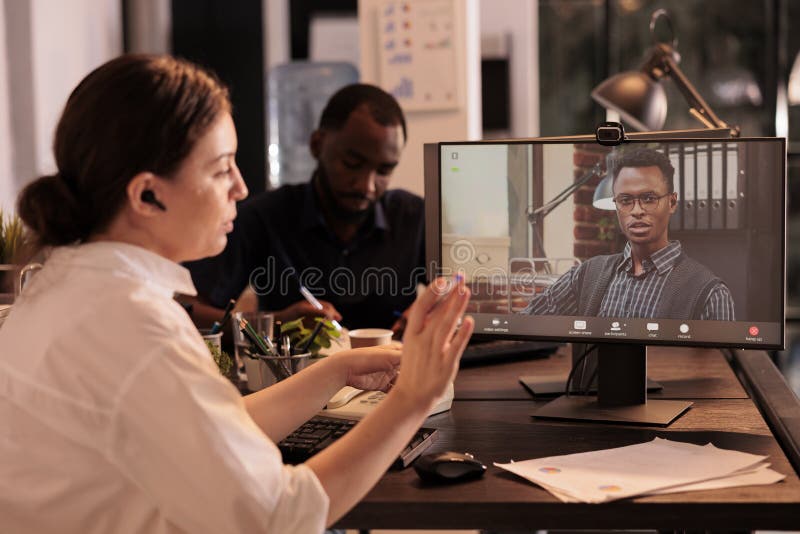 Colleagues Having Conversation on Corporate Online Meeting on Computer ...