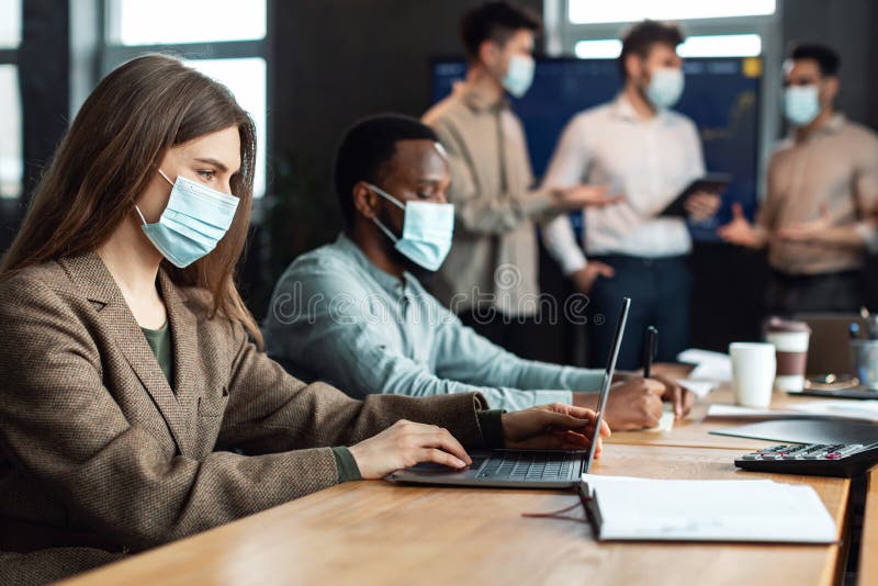 Colleagues Having Meeting in Boardroom, Working on Project Using Pc ...