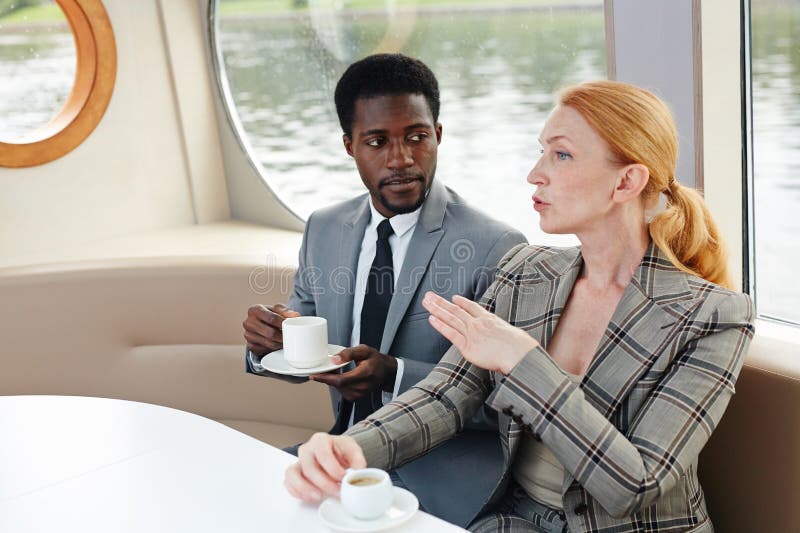 Colleagues having tea stock photo. Image of talking - 100952598