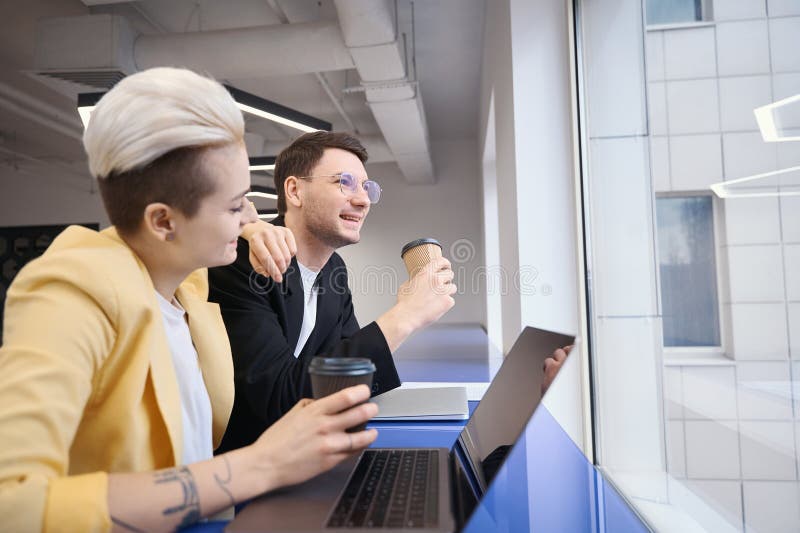 Colleagues Inspiring Drinking Coffee and Looking at Window Stock Photo ...