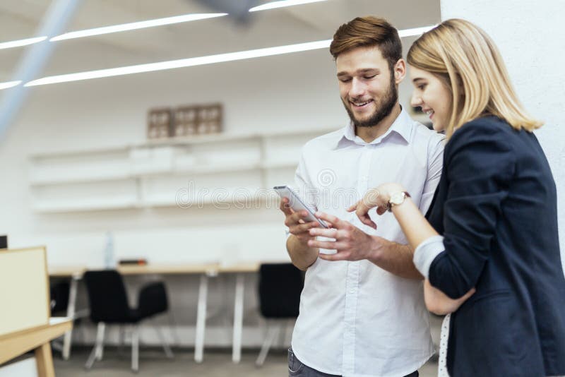 Colleagues Laughing Together Stock Image - Image of togetherness, group ...