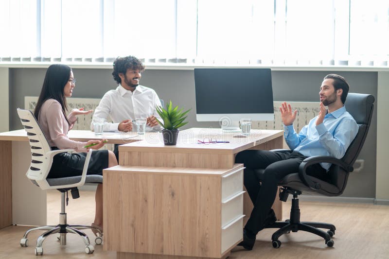 Colleagues in the Office Having a Discussion on a Project Stock Photo ...