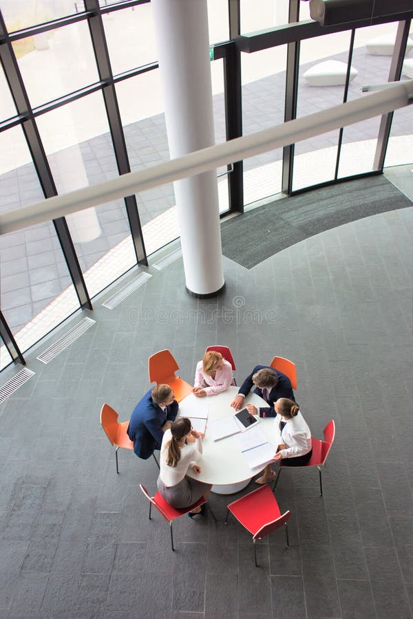 High Angle View of Colleagues Planning while Sitting during Meeting at ...