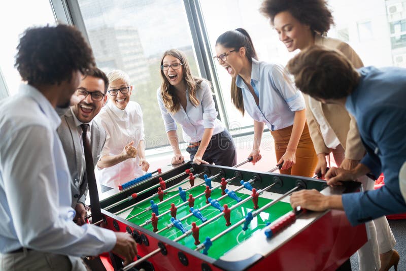 Colleagues Playing Table Football in the Break. Stock Image - Image of ...