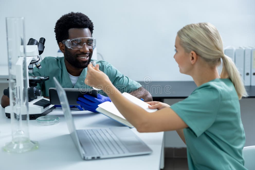 Colleagues Scientists Diligently Working in Modern Laboratory Using ...