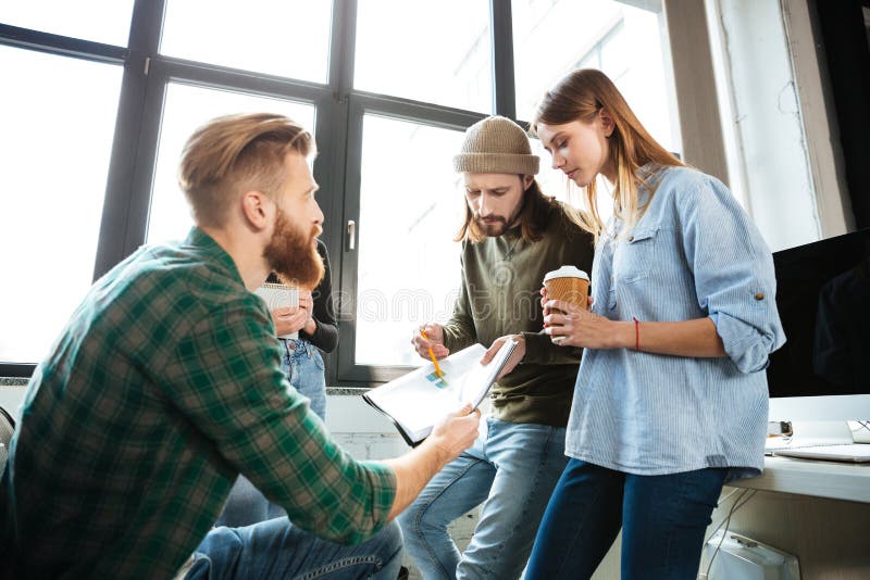 Colleagues Standing in Office and Talking with Each Other Stock Photo ...