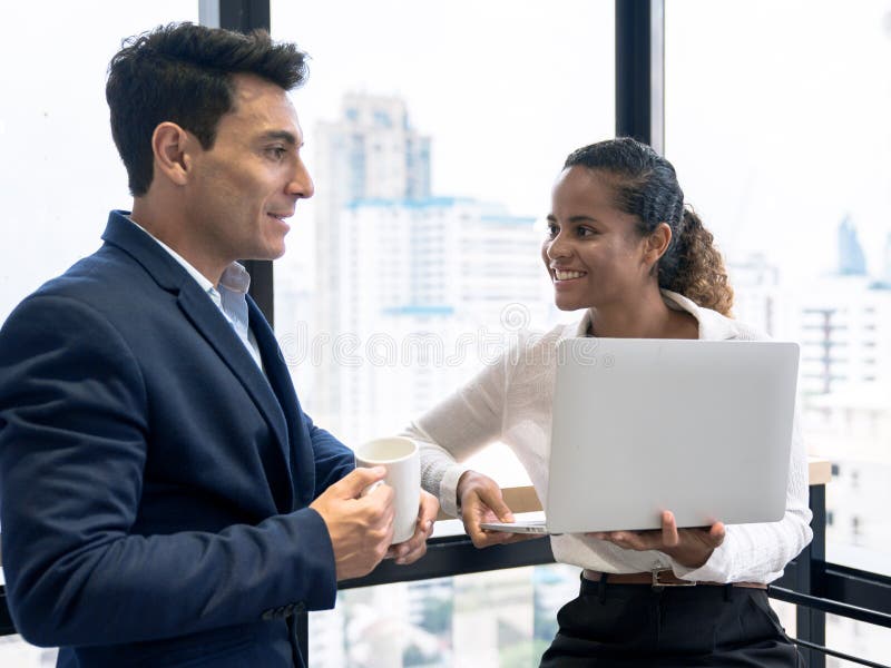 Colleagues Talk while Standing at the Office Window Stock Image - Image ...