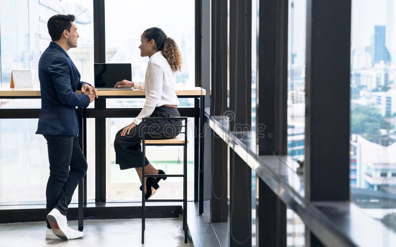 Colleagues Talk while Standing at the Office Window, Communication with ...
