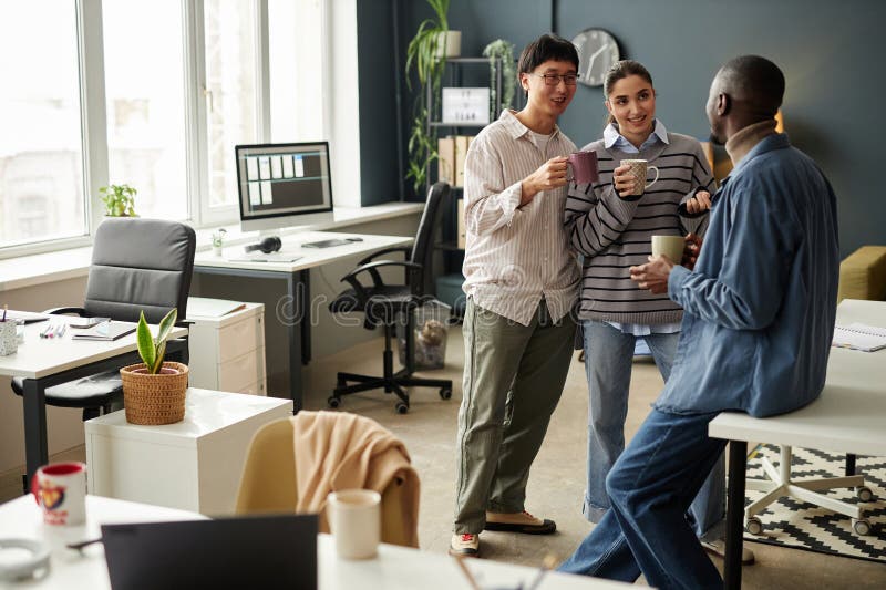 Colleagues Talking Cheerfully at Coffee Break Stock Photo - Image of ...