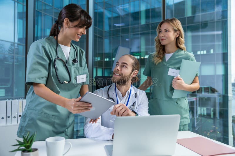 Colleagues Talking Discussing Medical Practice in Hospital Office Stock ...