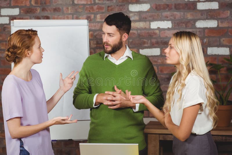 Colleagues Talking about Work in Office Stock Image - Image of business ...