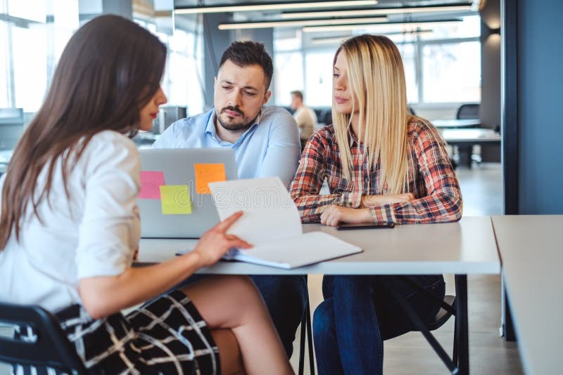 Colleagues Trying To Solve a Problem in Office Stock Image - Image of ...