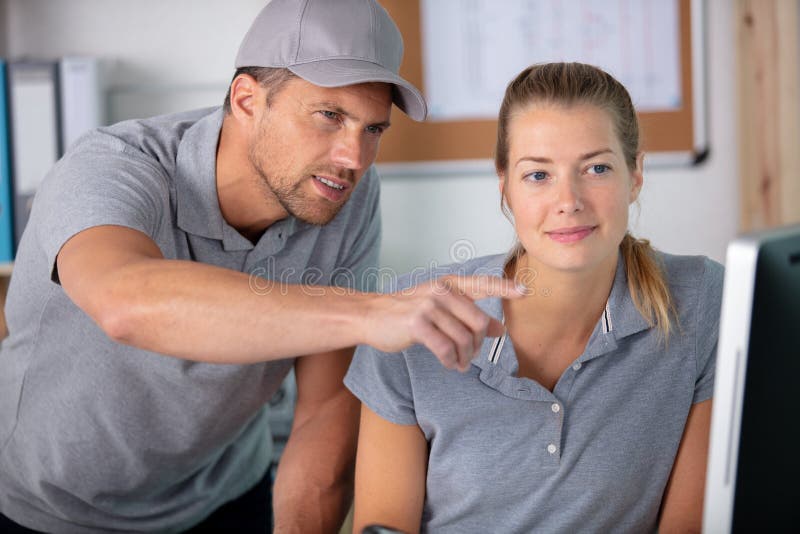 Colleagues in Uniform Looking at Computer Stock Image - Image of teams ...