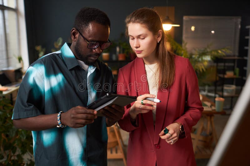 Colleagues Working Over New Project in Team in Office Stock Image ...