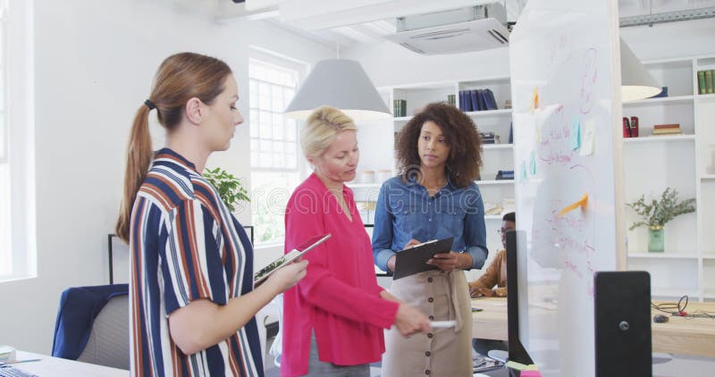 Colleagues Working with a Board Stock Footage - Video of brianstorm ...