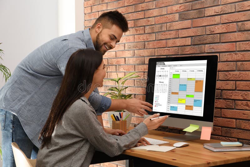 Colleagues Working with Calendar App on Computer Stock Image - Image of ...
