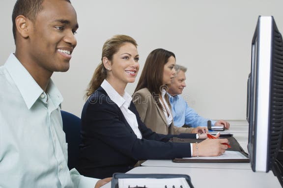 Colleagues Working in Computer Room Stock Photo - Image of ...