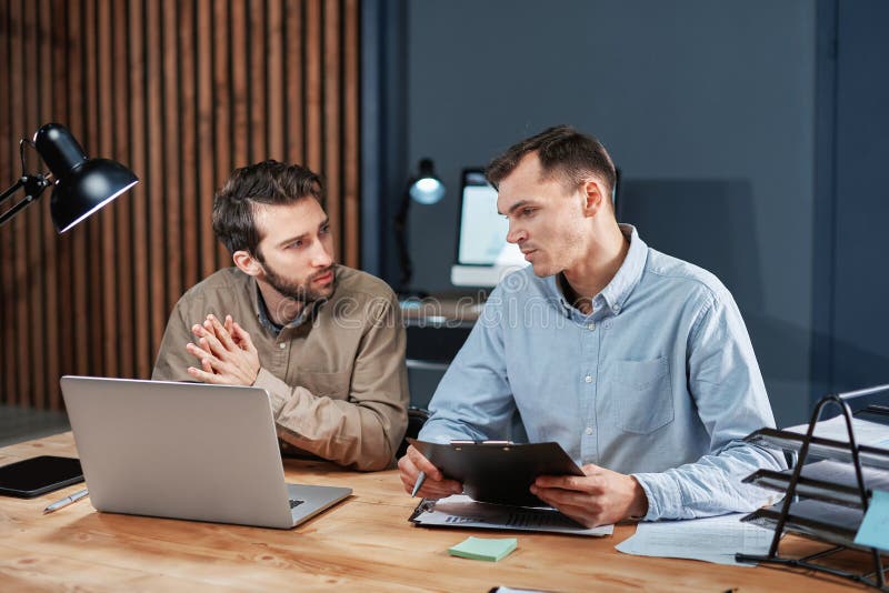 Colleagues Working on a New Project in the Night Office. Stock Image ...
