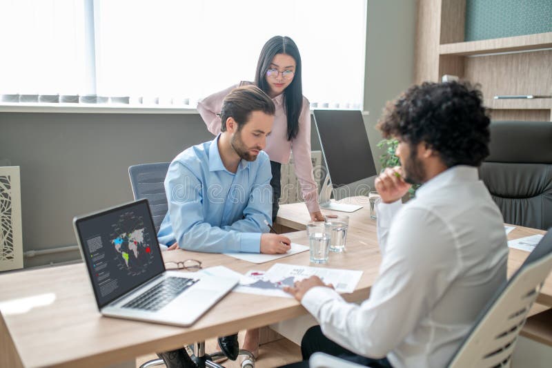 Colleagues Working in the Office and Discussing Project Details Stock ...