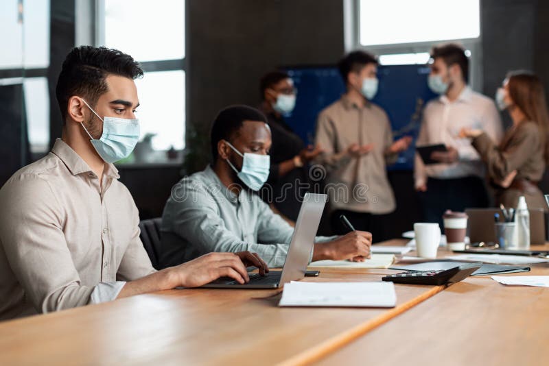 Colleagues Working on a Project, Using Laptop Computers Stock Photo ...
