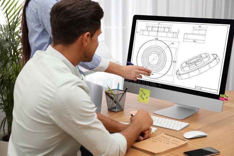 Colleagues Working with Technical Drawing on Computer Stock Image ...