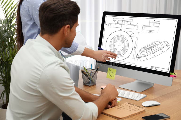 Colleagues Working with Technical Drawing on Computer Stock Image ...