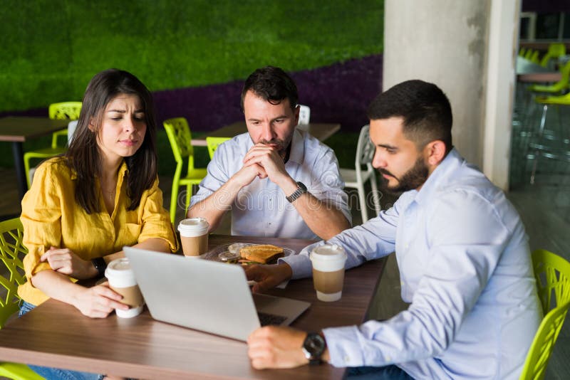 Colleagues Working Together at a Cafe Stock Image - Image of lunch ...