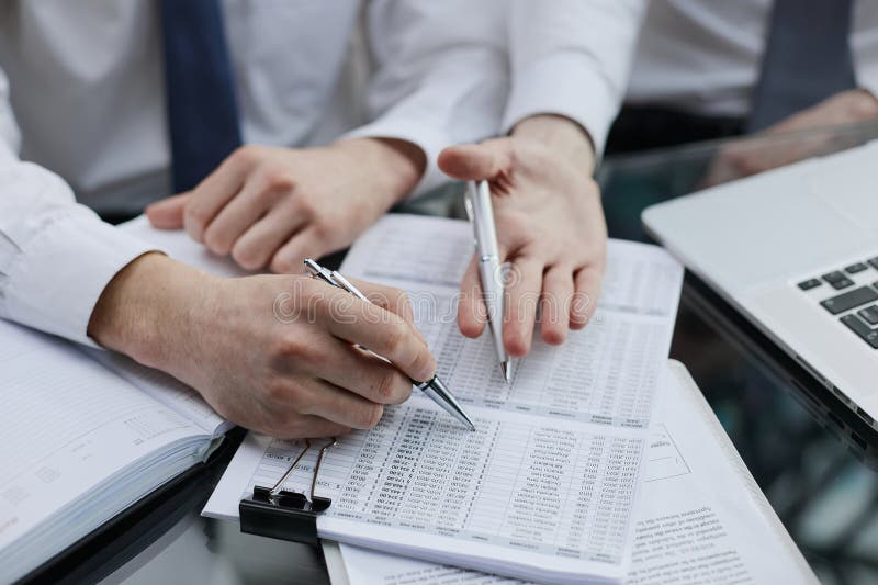 Close Up of Two Office Worker Hands Analyzing a Growth Graph on a ...