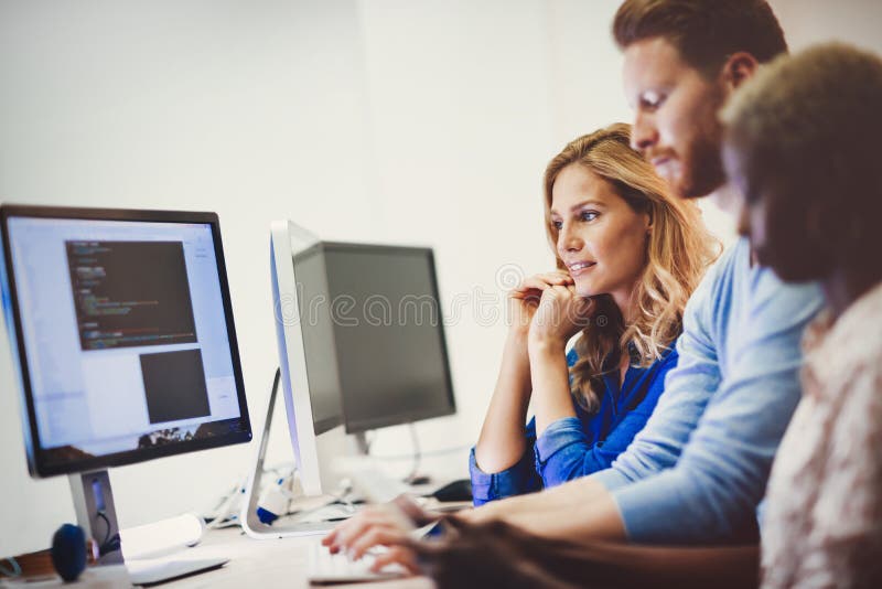 Colleagues Working Together in Company Office Stock Image - Image of computer, business: 132910235