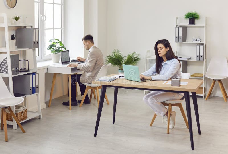 Colleagues Working Together Throughout the Workday in Office Stock ...