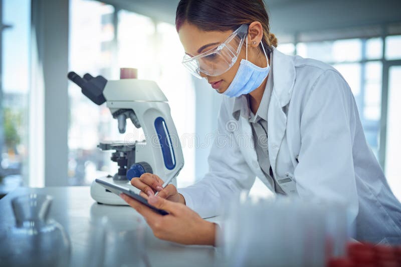 Collecting Data on Her Device. a Female Scientist Using a Digital ... Collecting Data on Her Device. a Female Scientist Using a Digital ...
