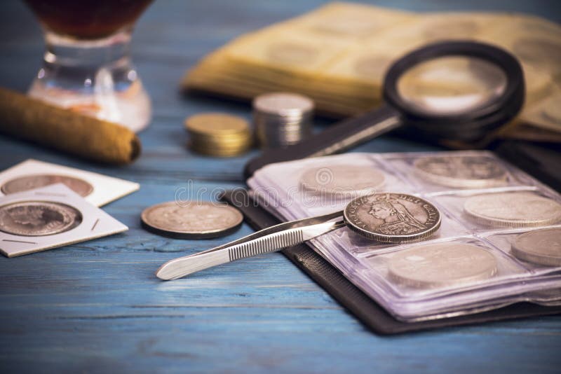 Collecting old coins stock photo. Image of retro, magnifier - 100209674