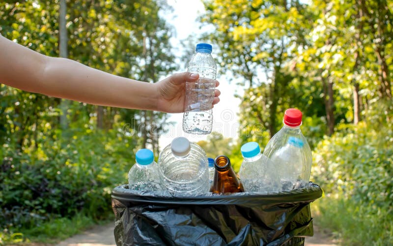 Collecting Plastic Bottles and Glass Bottles for Reuse. Stock Photo ...